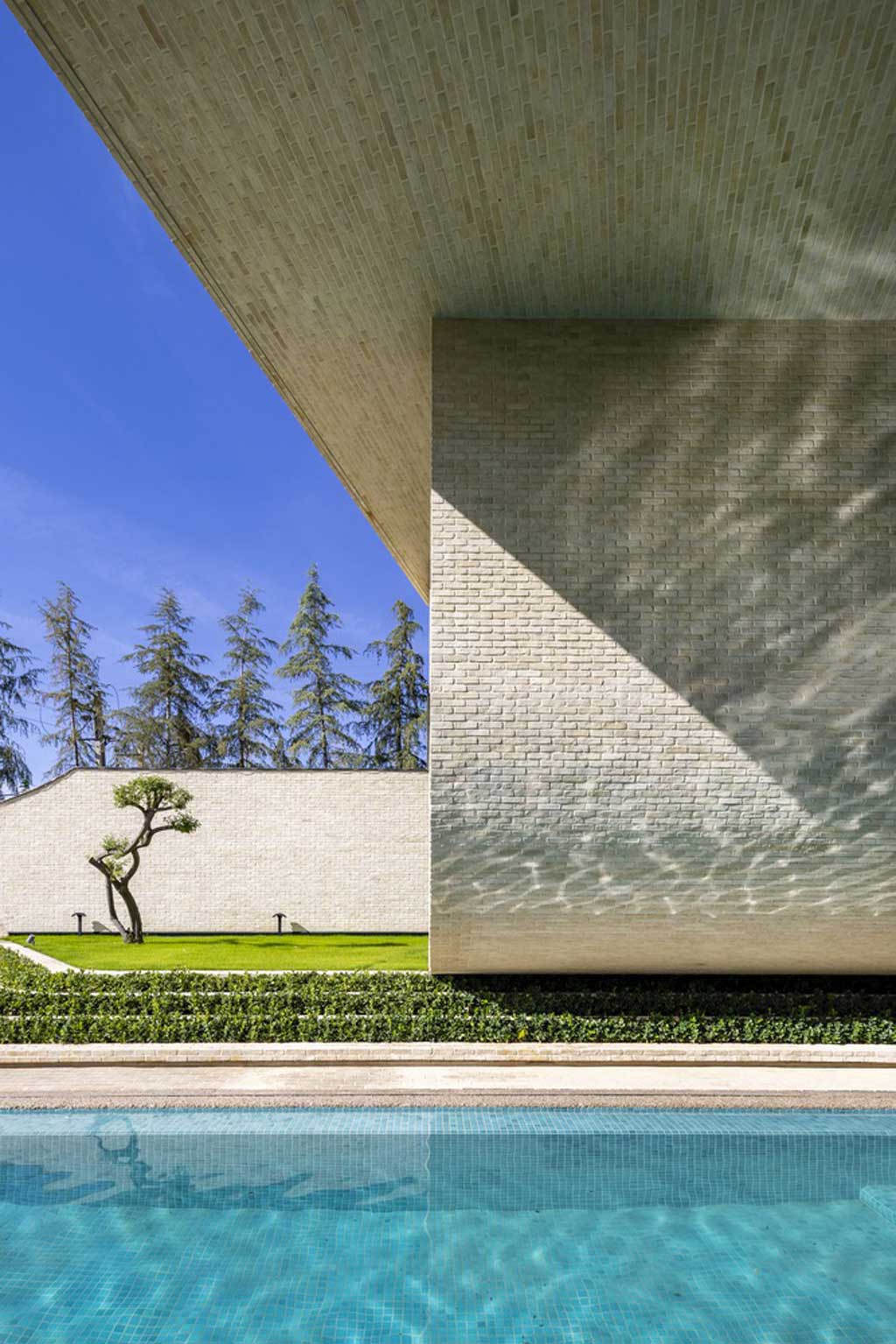 Warm Concrete and Glass Shapes Defining a Modern Villa’s Private ...